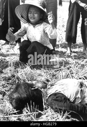 VIETNAM WAR: DEAD VIET CONG. /nAmerican infantrymen take a lunch break ...