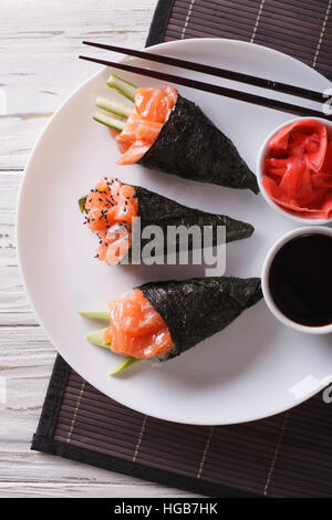 Closeup of salmon temaki (Japanese cuisine) on a plate Stock Photo - Alamy