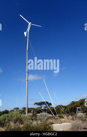 Showing wind turbine spinning blades in rural wind farm, with gridlines ...