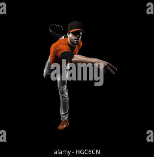 Pitcher Baseball Player with a orange uniform on baseball Stadium Stock ...