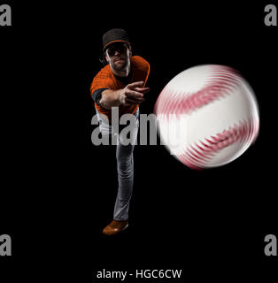 Pitcher Baseball Player with a orange uniform on baseball Stadium Stock ...