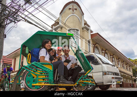 A Group Of Filipino Tourists Pose In Traditional Head Wear During The ...