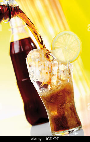 Bottle pouring coke in drink glass with ice cubes Stock Photo: 173793573 - Alamy