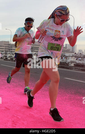 Pasay City, Philippines. 8th Jan, 2017. Runners covered in colored ...