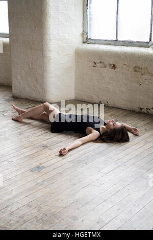 Dead woman's body laying down on the floor Stock Photo - Alamy