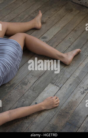 Dead woman laying down on the floor Stock Photo - Alamy