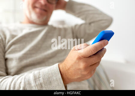 close up of old man texting on smartphone at home Stock Photo - Alamy