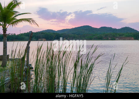 Colorfull sky after sunset over the lake in Thailand Stock Photo - Alamy