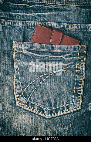 old wallet in back pocket blue jeans Stock Photo - Alamy