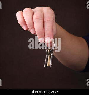 ordinary hands dangling a bunch of keys Stock Photo - Alamy