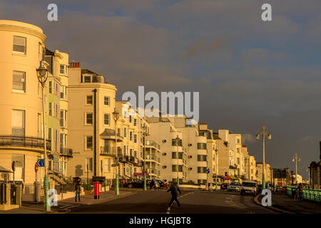 Golden light on the seafront at Brighton making the Regency buildings ...