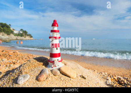 Miniature lighthouse at the beach Stock Photo - Alamy