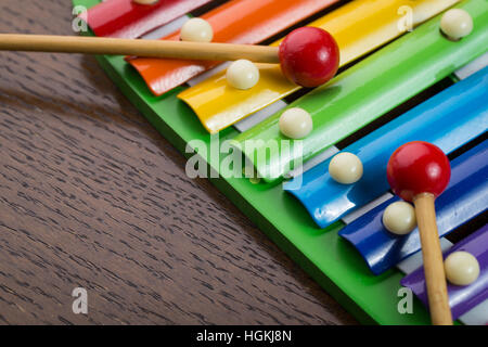 Rainbow colored toy xylophone Stock Photo - Alamy