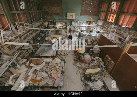 Factory for Production of plaster molds. cluttered dusty old warehouse ...