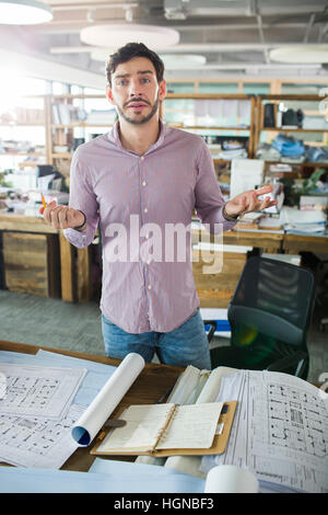 Confused business people, architect and blueprint in planning, strategy ...