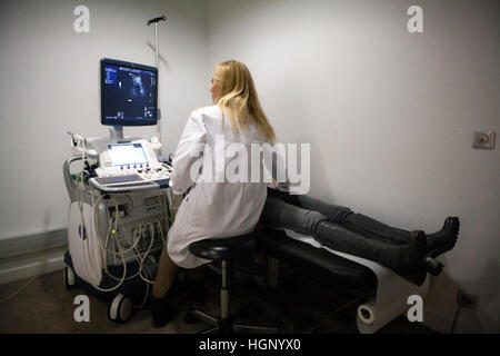 Woman undergoing pelvic ultrasound scan Stock Photo - Alamy