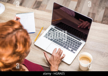 Overhead view of woman using smart phone while traveling with boyfriend ...