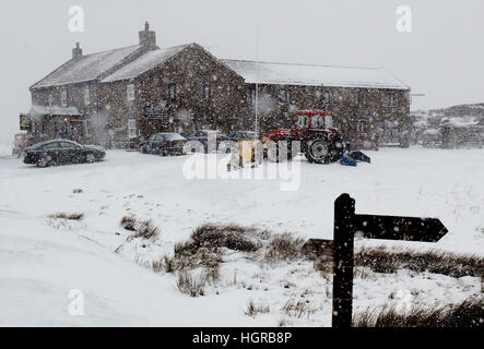 Snow falls at the Tan Hill Inn in North Yorkshire, as blizzard ...