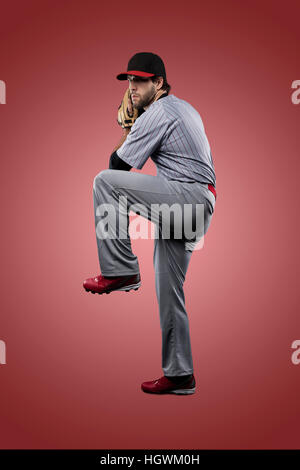 Pitcher Baseball Player with a red uniform on baseball Stadium Stock ...