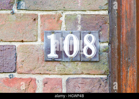 House number 108 sign on door Stock Photo - Alamy