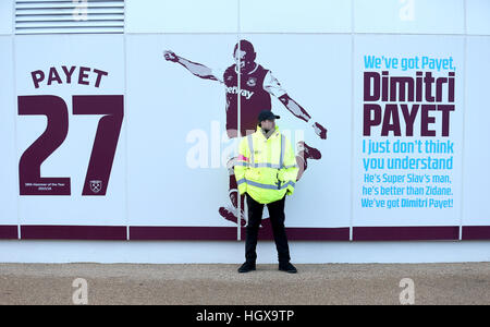 A steward stands near Dimitri Payet signage before the Premier League ...