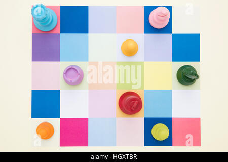 Colorful chess markers on chessboard Stock Photo - Alamy