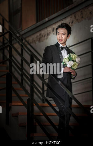 Groom with flowers Stock Photo - Alamy