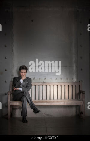 groom is waiting for the bride sitting sitting on the bench Stock Photo ...