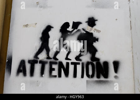 Pickpocket warning sign stencilled on to a white wall Stock Photo - Alamy