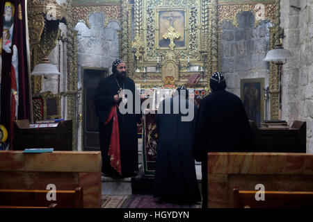 Syriac Orthodox clerics praying inside San Marcos or Saint Mark Syrian ...