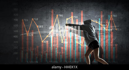 Young woman boxing against graphs background. Mixed media Stock Photo ...