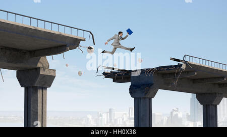 Businessman jumping over a gap in the bridge as a symbol of bridge ...