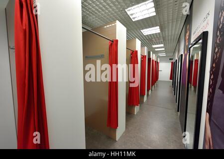 A disability chair in a changing room cubicle in a UK store Stock Photo ...