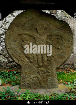 C9th disc-headed cross-slab, Llangan church: crucified Christ flanked ...
