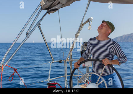young man skipper at his sail boat Stock Photo - Alamy