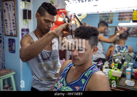 Barber shop in old Havana, Cuba, with men waiting for haircuts and ...