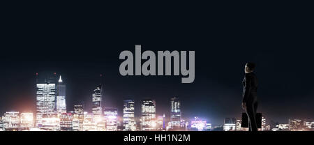 Businesswoman viewing night glowing city Stock Photo - Alamy