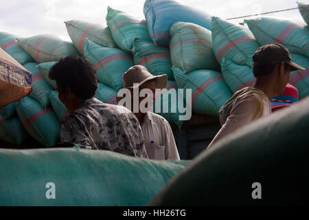 Men loading a truck with sacks of rice on Bazaar Road, Fort Cochin ...