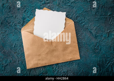 Envelope with blank card on color background Stock Photo - Alamy