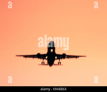 Landing aircraft on final approach. The runway lights can be seen in ...