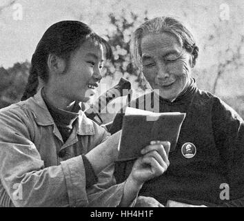 Chinese people reading a book of quotations by their leader Mao Zedong ...