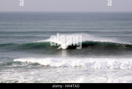 Surfers ride the Cribbar wave reaching heights of 25ft in Newquay ...