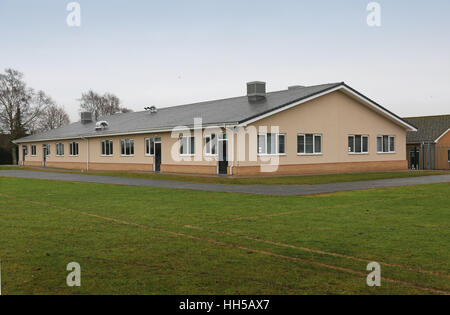 Exterior of a new school classroom block clad in spectacular green and ...