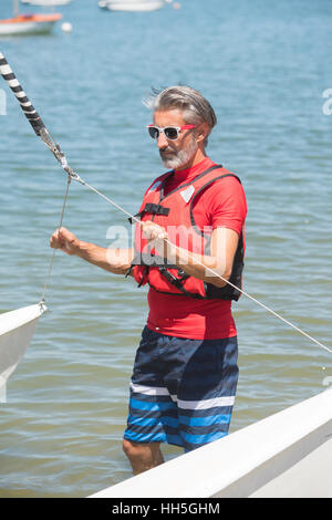 professional waterman training on lake with catamaran Stock Photo - Alamy