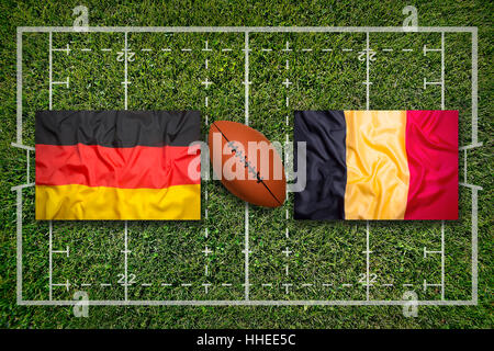 Germany vs. Belgium flags on a green soccer field Stock Photo - Alamy