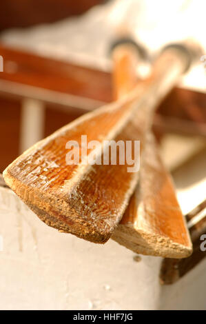 Two crossed boat oars on a dock Stock Photo - Alamy