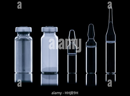 Different types of vials of different liquids. Isolated on a black ...