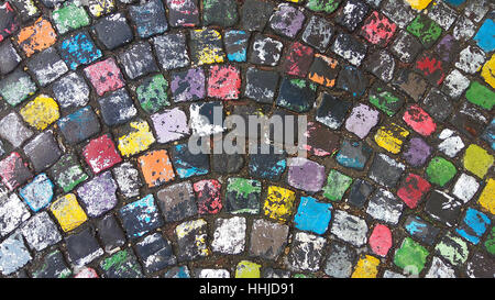 Many colored painted cobble stone pavement in after rain Stock Photo ...