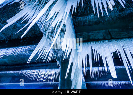 Lot of sharp and long icicles Stock Photo - Alamy
