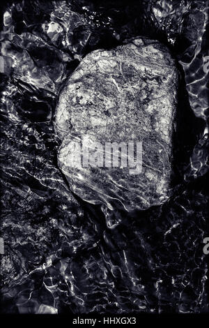 stone under the mountain water, note shallow depth of field Stock Photo ...